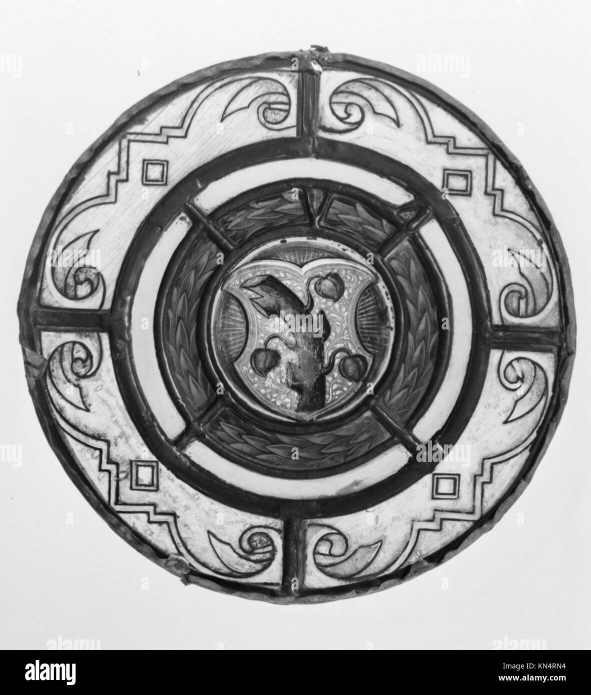 This armorial panel features a heraldic design, often used to signify ...