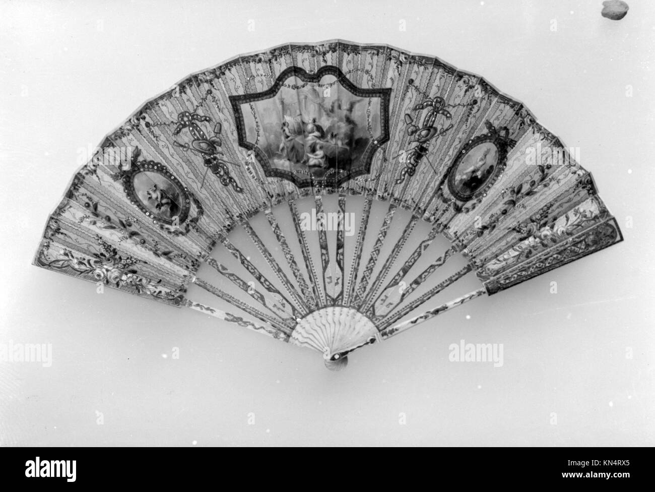 This 18th-century French fan is crafted from silk and ivory, adorned ...