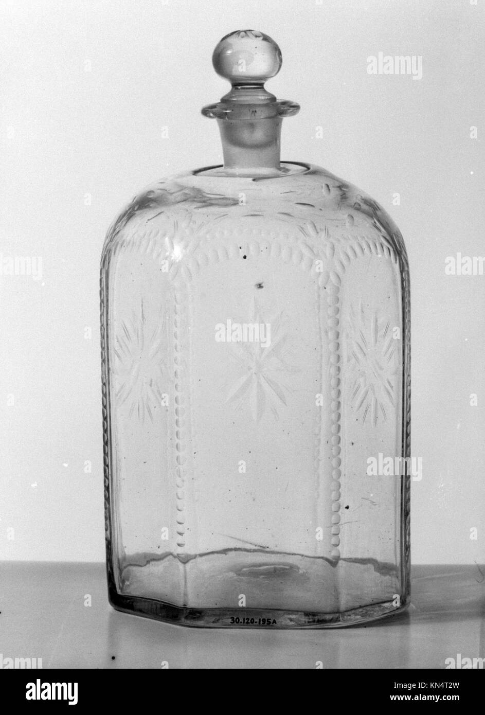 This bottle with a stopper, crafted from fine materials, is a ...