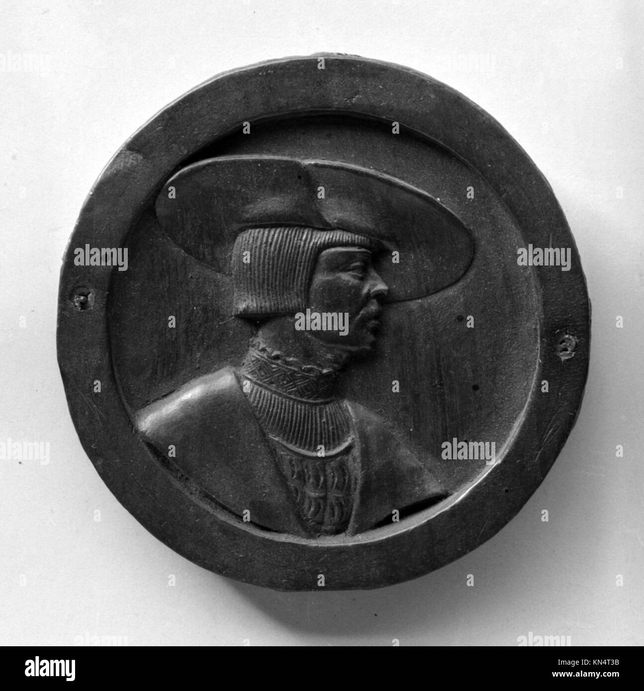 This bust represents a man, sculpted with detailed facial features ...