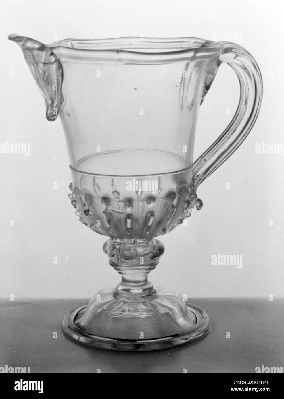 A metal ewer, an elegant pitcher-like vessel used for pouring liquids ...
