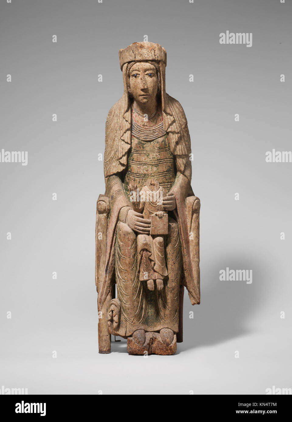 This painting depicts the Virgin Mary enthroned with the Christ Child, a classic representation ...