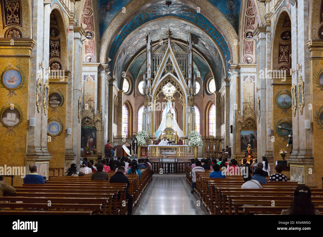 Ecuador church interior with people attending a service, Santo Domingo ...
