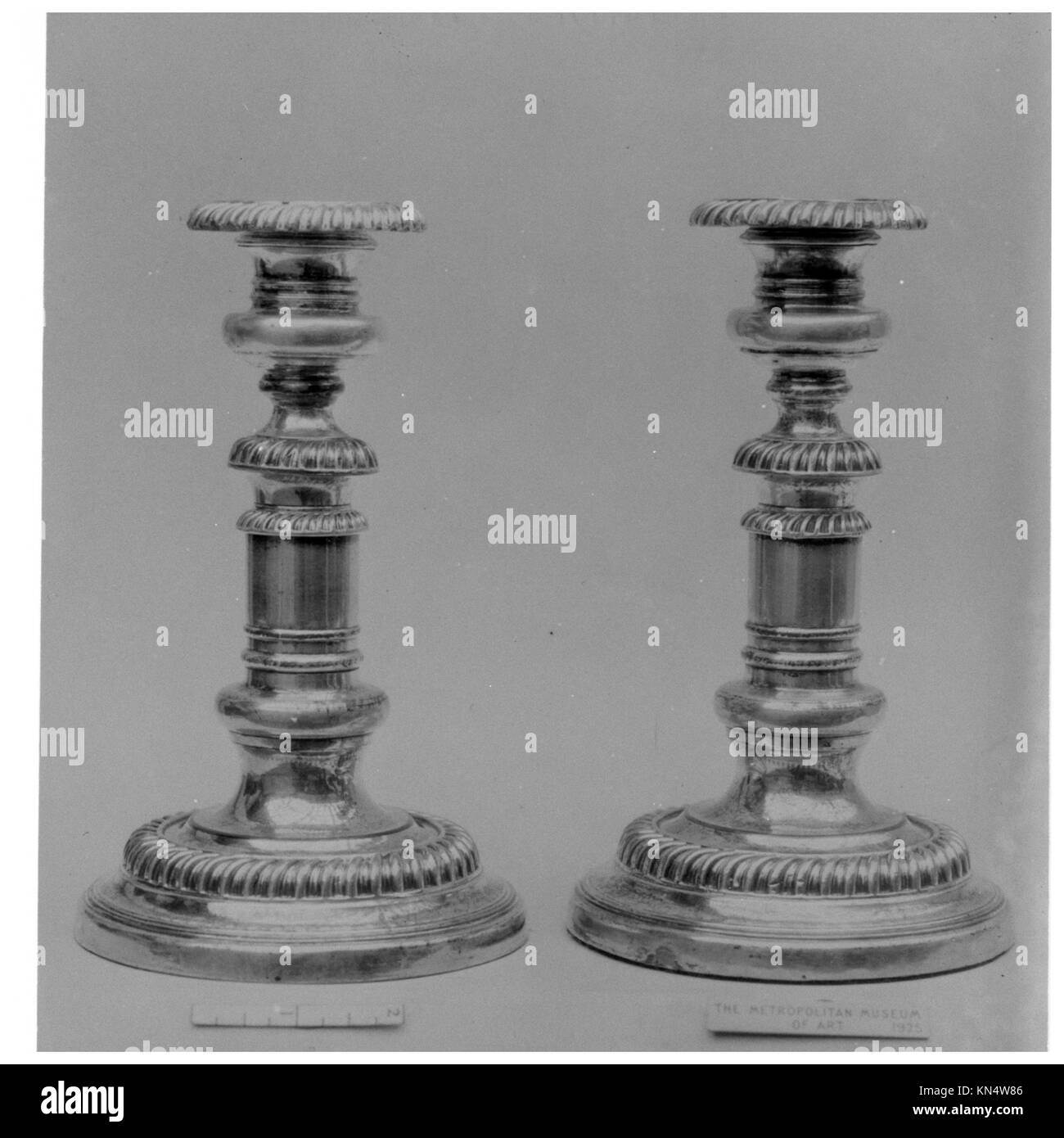 This candlestick, made of metal, demonstrates the delicate balance of ...