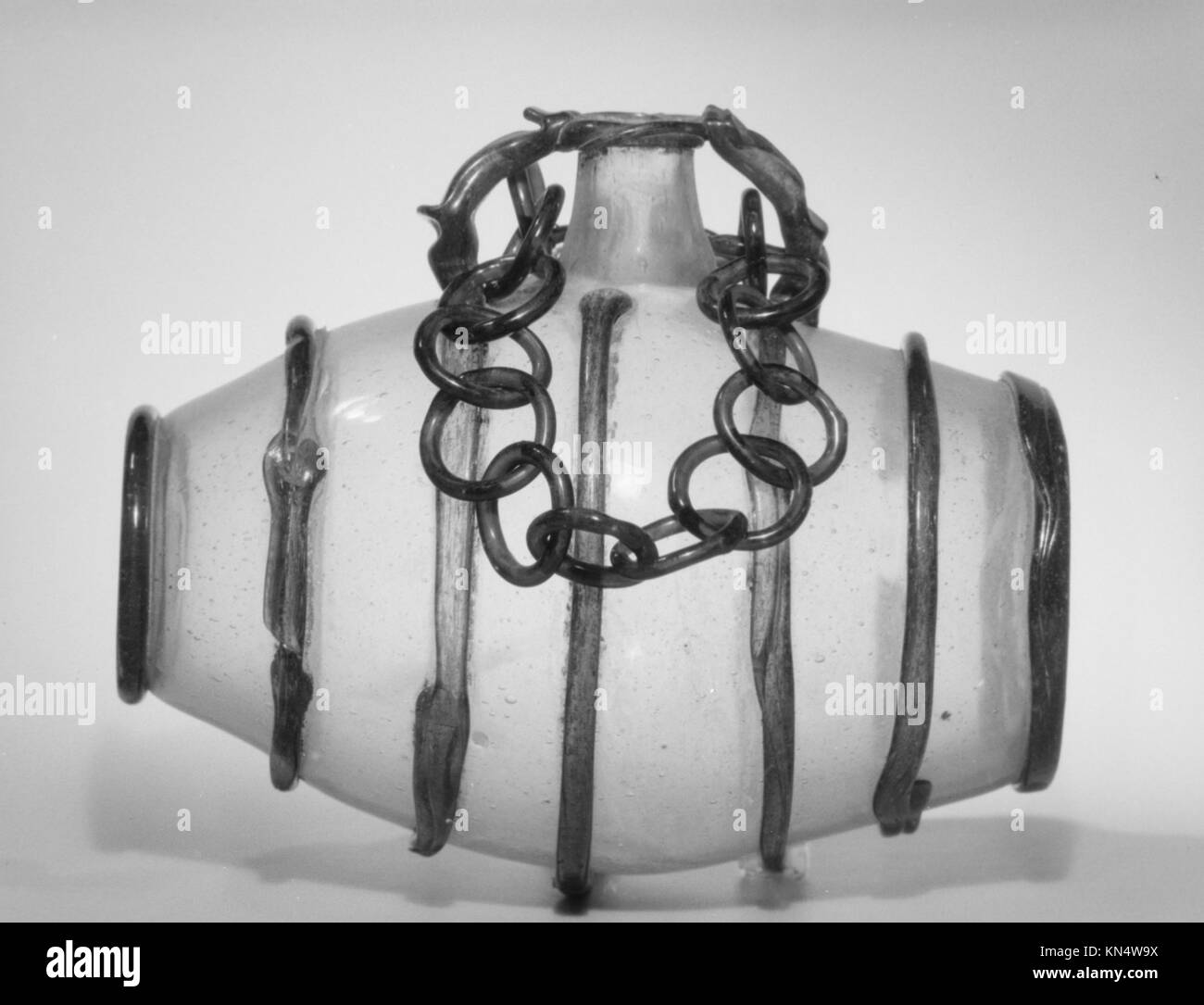 This 17th-century flask is crafted from glass and features a simple yet ...