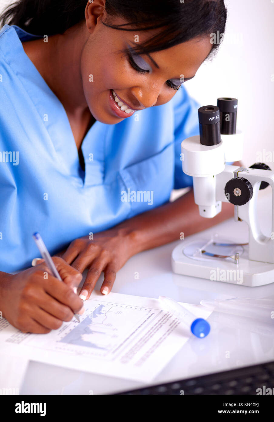 Scientific woman working with documents at laboratory Stock Photo - Alamy