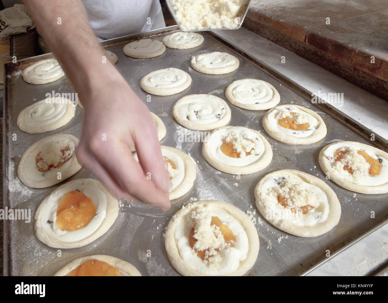 Professional Bakery - Adding Cheese on Top of Pastry before Baking ...