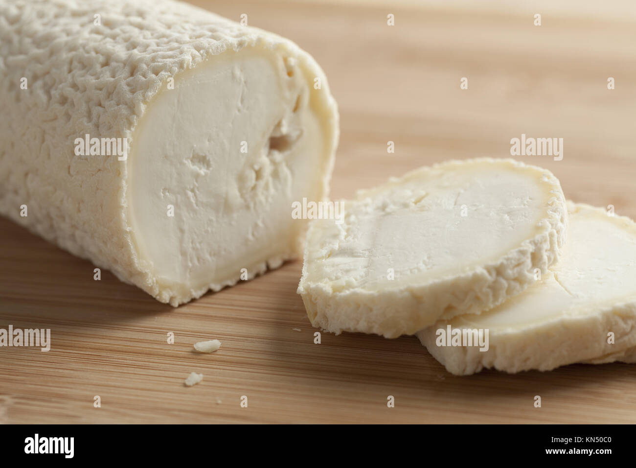 Fresh caprifeuille cheese and a slice Stock Photo - Alamy