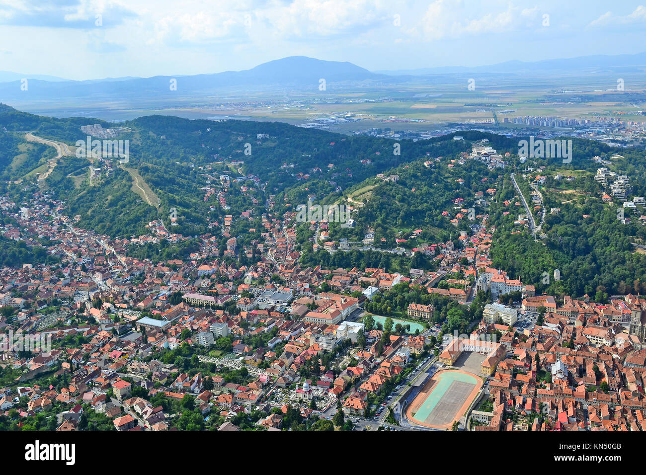 View of Brasov city in the valley, Romania Stock Photo - Alamy