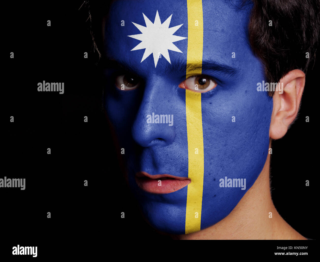 Flag of Nauru Painted on a Face of a Young Man Stock Photo - Alamy
