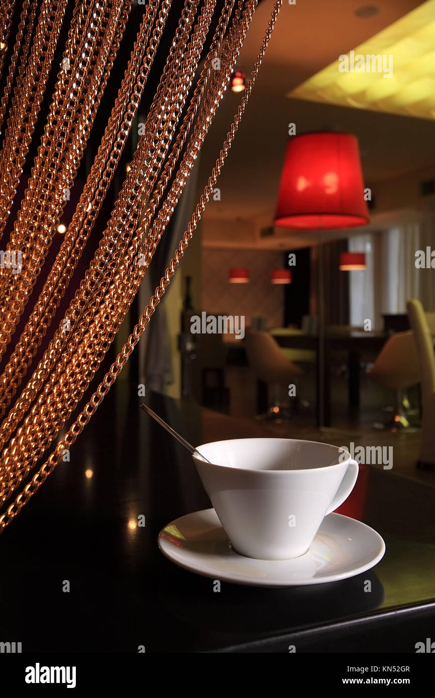 Cup of hot coffee on a bar rack Stock Photo - Alamy