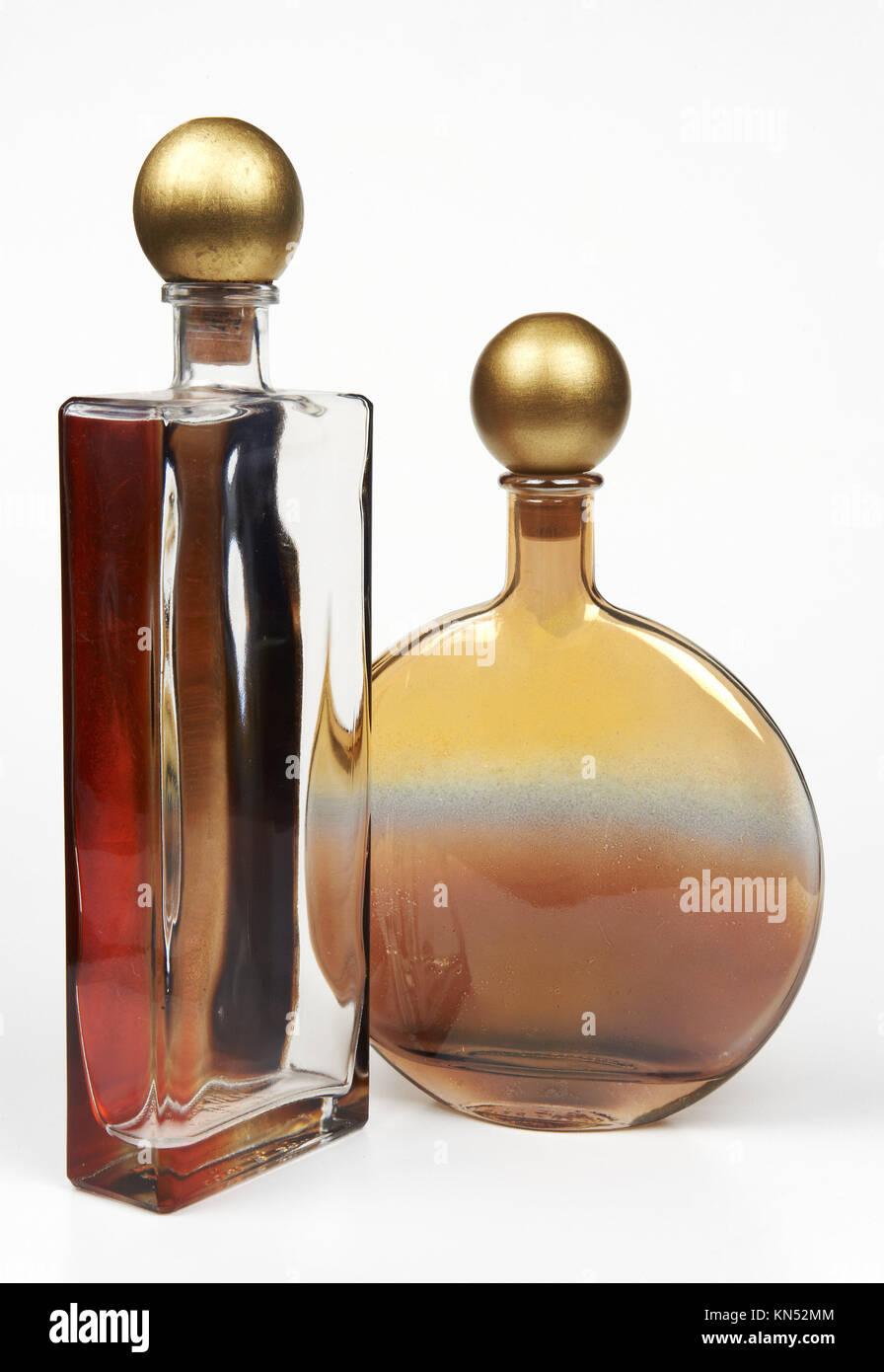 two colored bottles in white background Stock Photo - Alamy