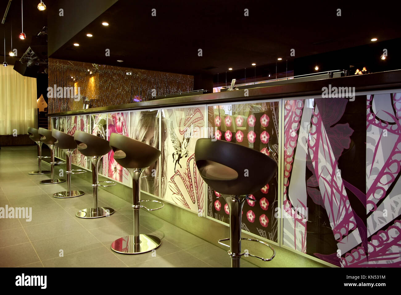 Rack of a bar with high chairs Stock Photo - Alamy