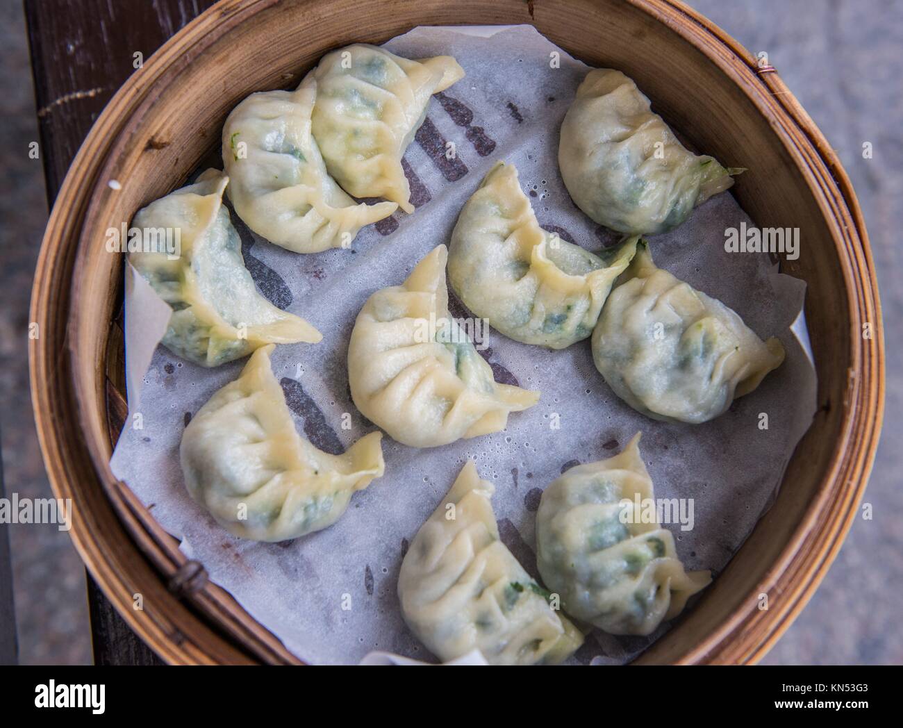 shanghai dumplings with spinach steamed in bamboo basket Stock Photo ...