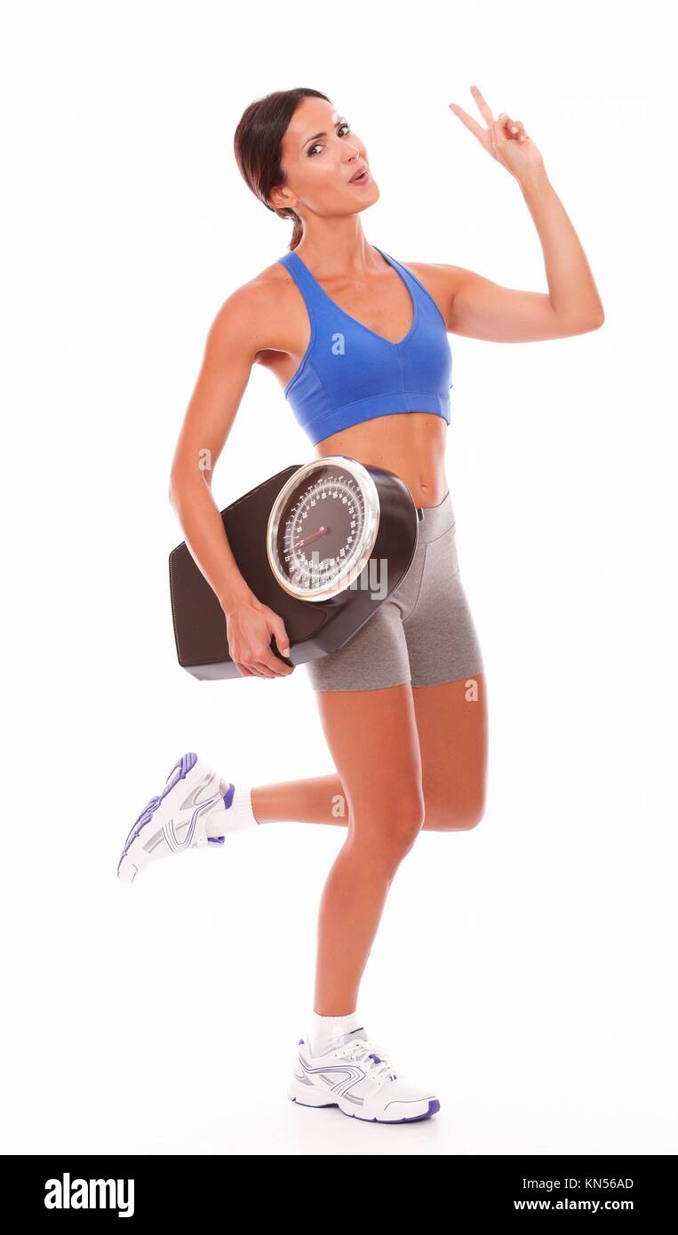 Woman holding weight scale hi-res stock photography and images - Alamy