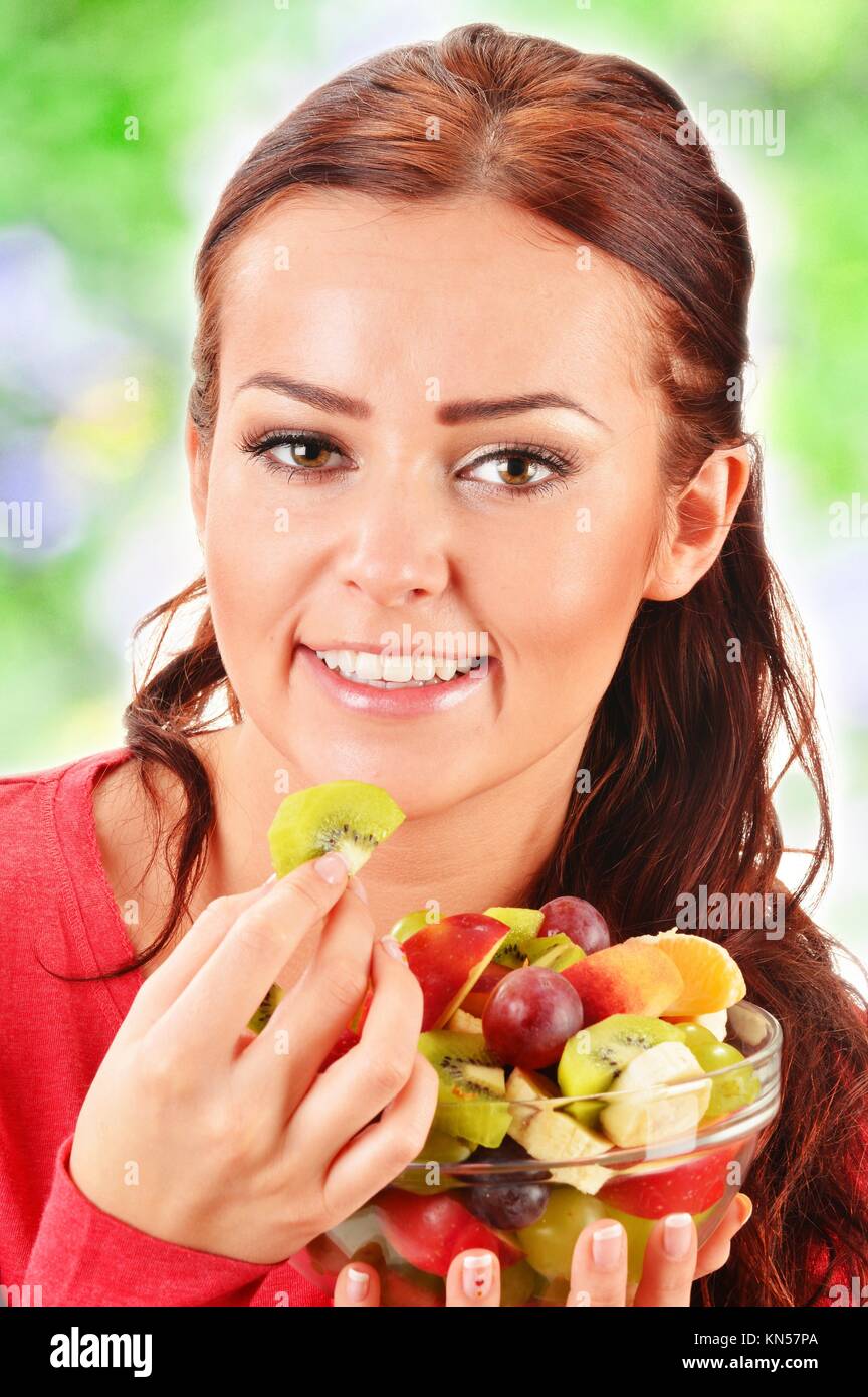 Overweight woman eating salad hi-res stock photography and images - Alamy