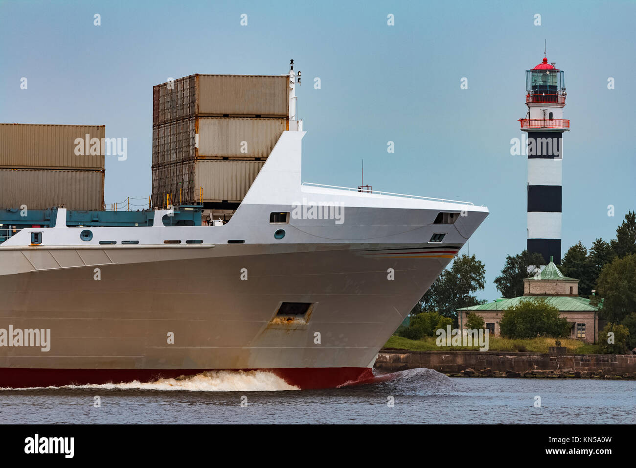 Grey container ship. Logistics and production import Stock Photo - Alamy