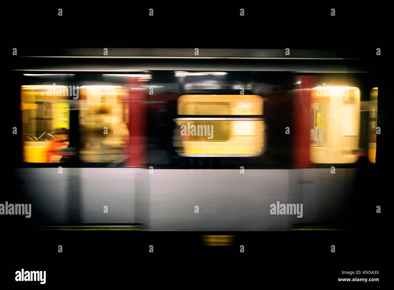 Moving train at night - subway line Stock Photo - Alamy