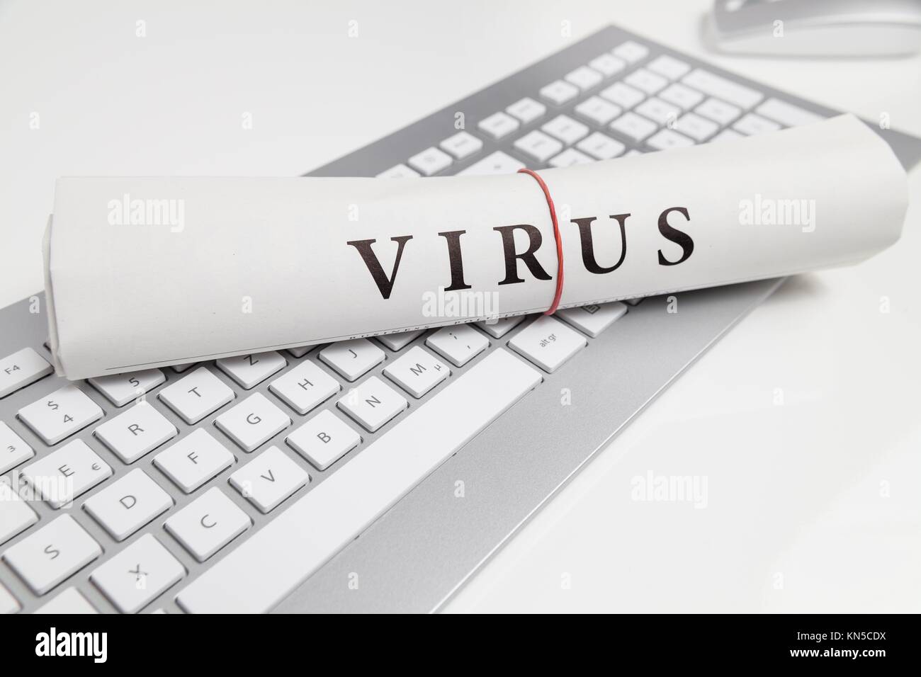 virus written on newspaper on desk Stock Photo - Alamy
