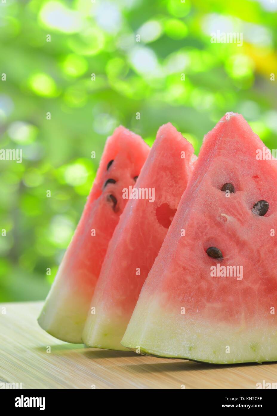 Slices of watermelon on natural background Stock Photo - Alamy