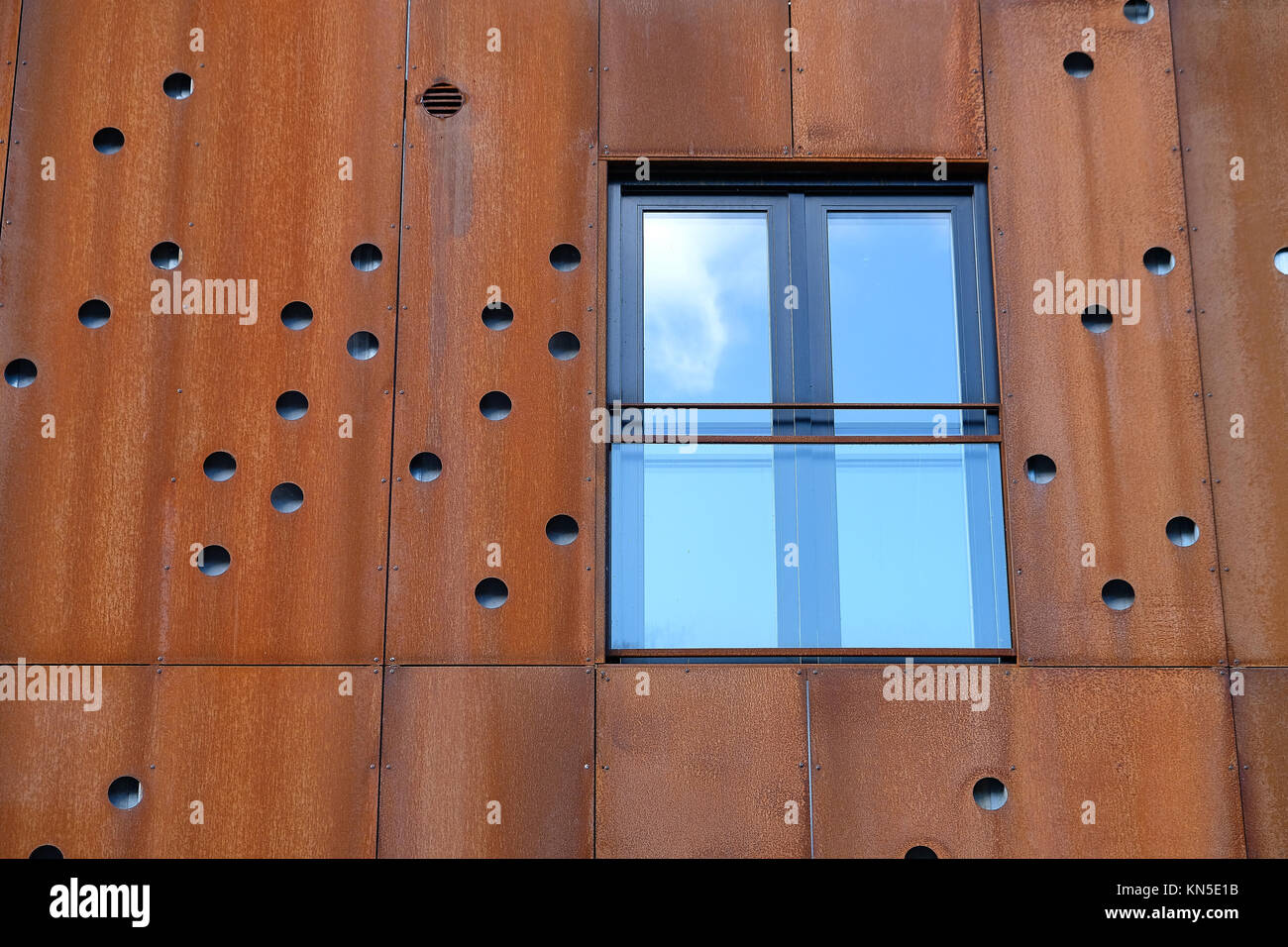 Closeup of window with french balcony in building facade with rusty ...