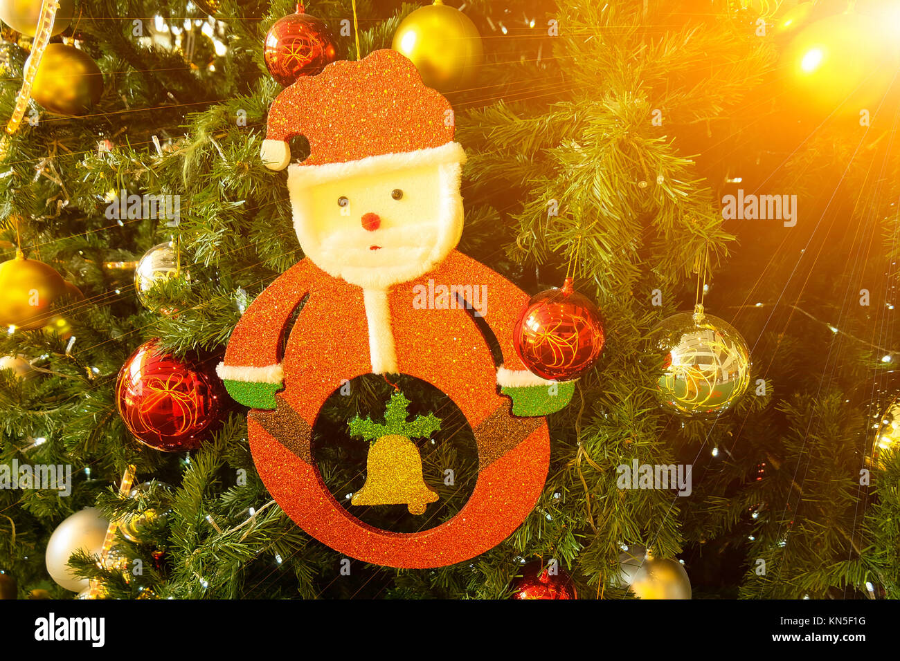 decorated christmas fir tree and santa closeup with flares Stock Photo ...