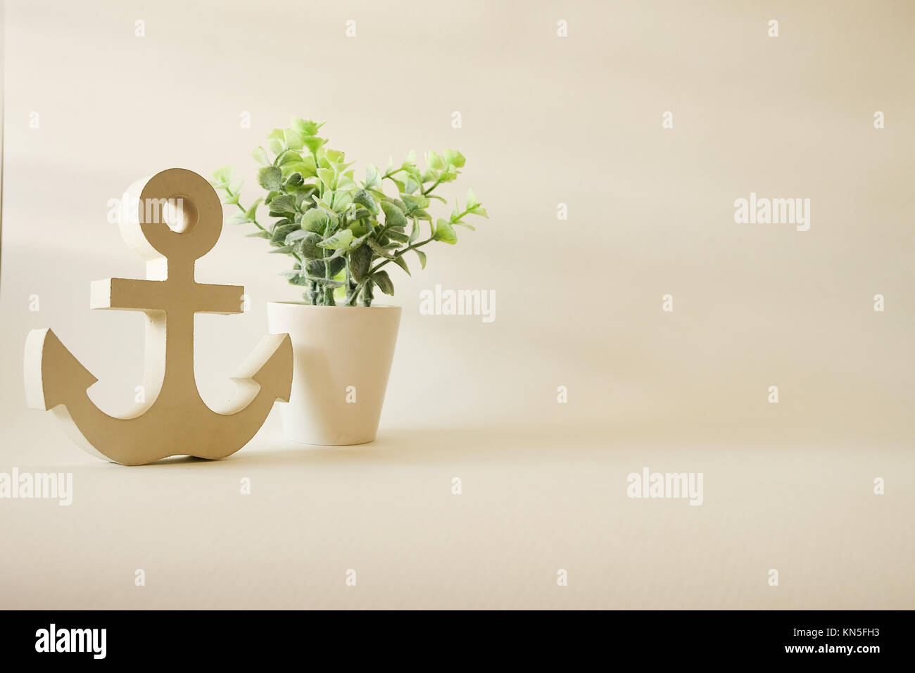 wooden anchor decorative with small tree in pot vintage style ...