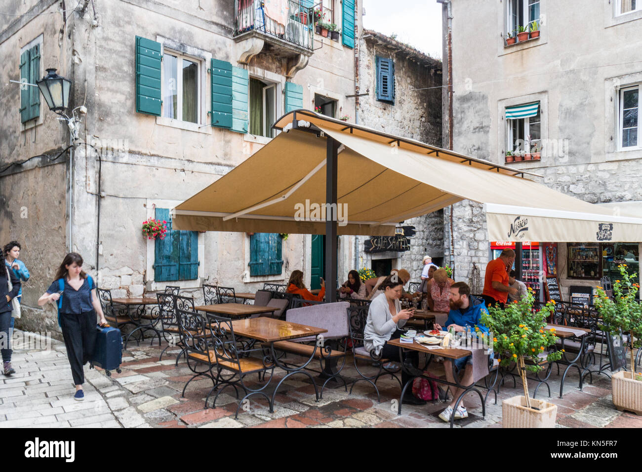 Tourists in cafe, Kotor Montenegro Stock Photo - Alamy