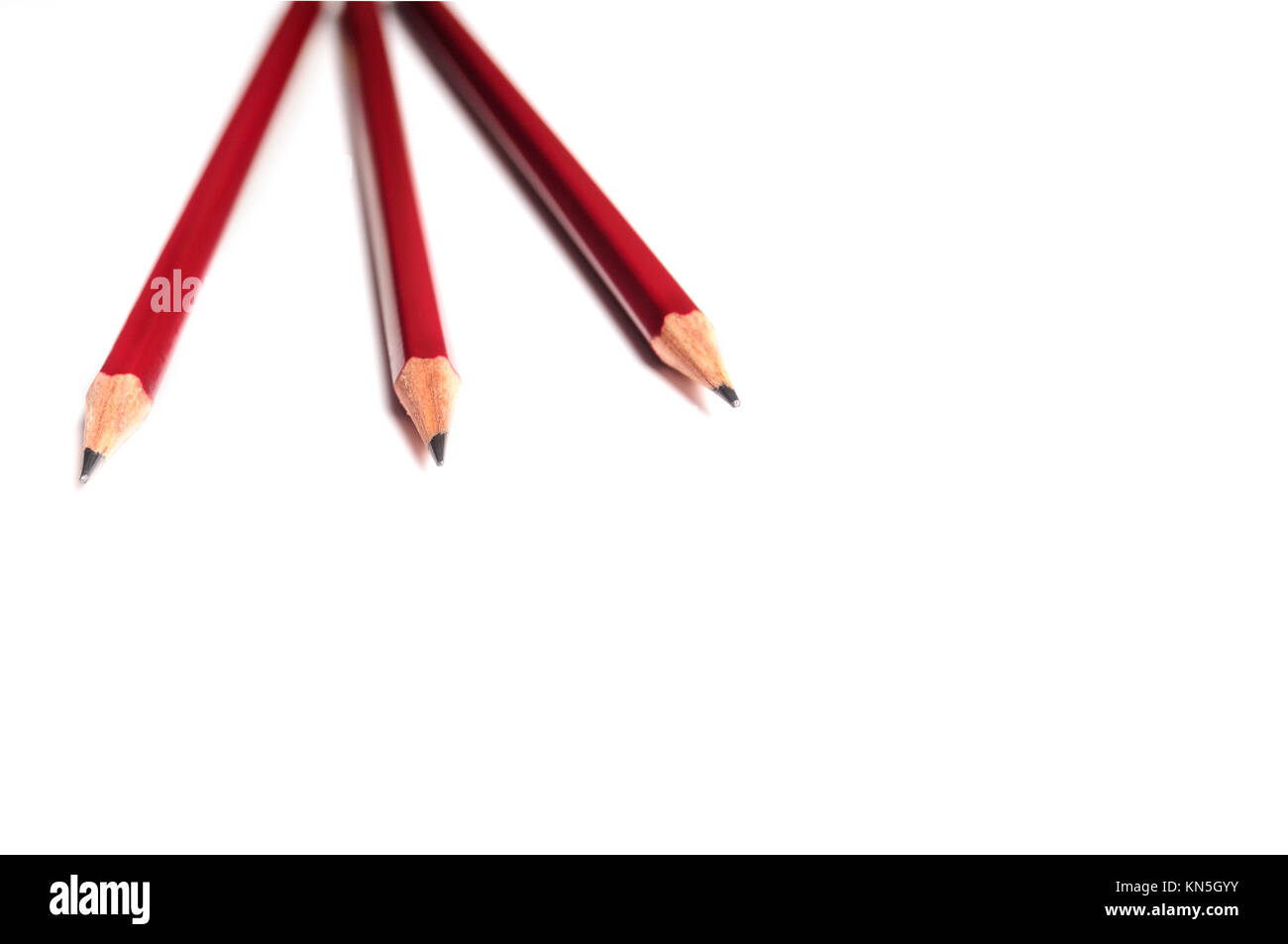 three red pencils isolated Stock Photo - Alamy
