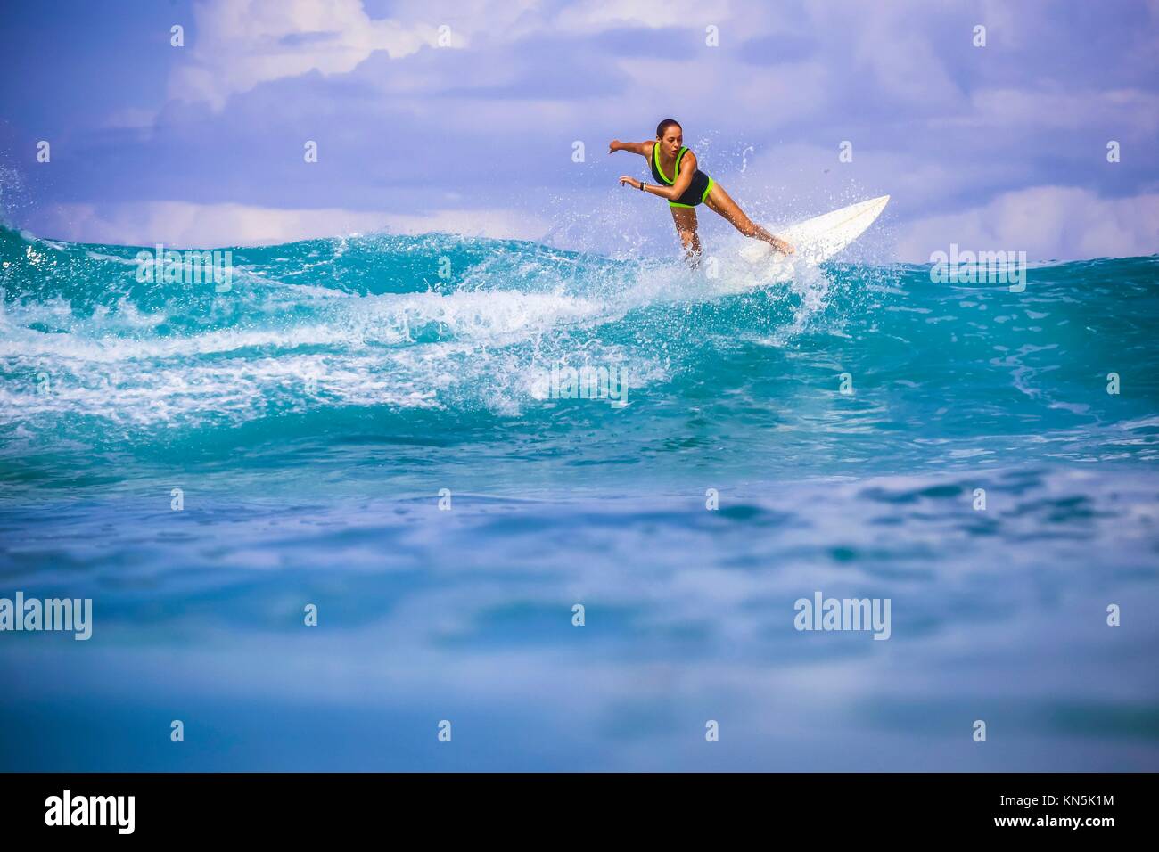 Surfer girl on wave indonesia hi-res stock photography and images - Alamy