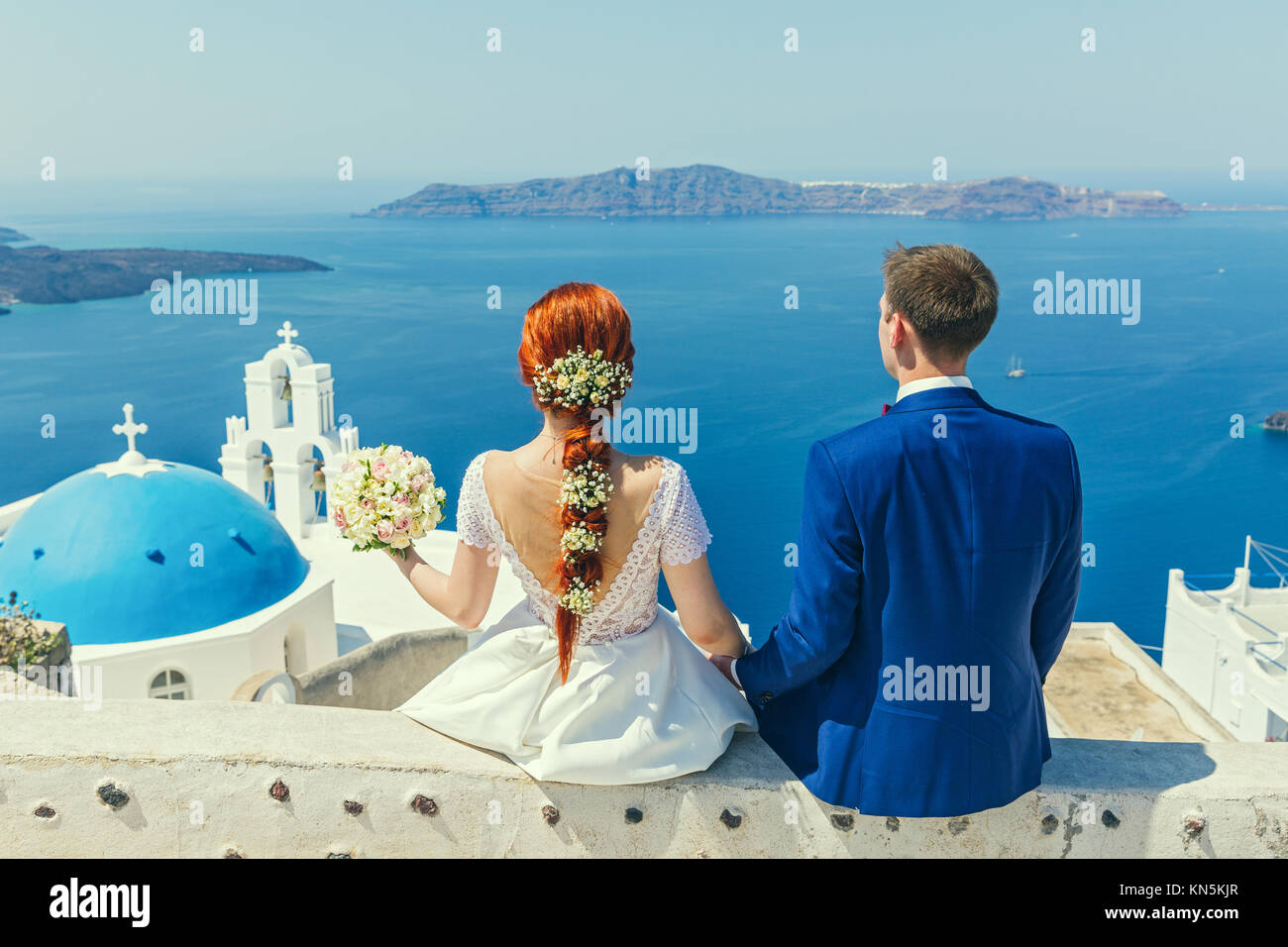 Wedding couple sitting and watching the sea Stock Photo - Alamy