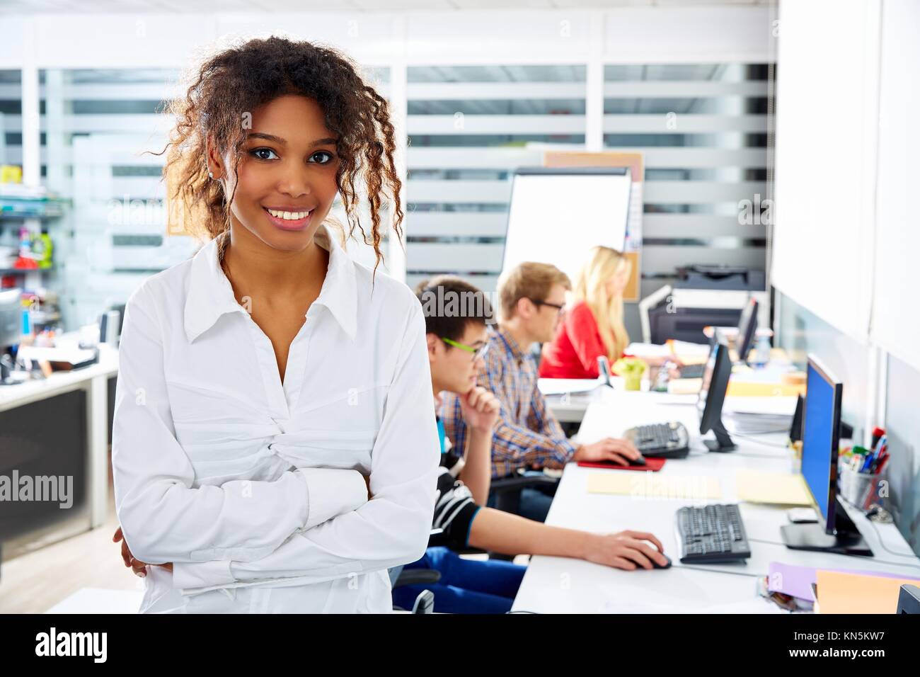African businesswoman young in office with computer in a desk row Stock ...