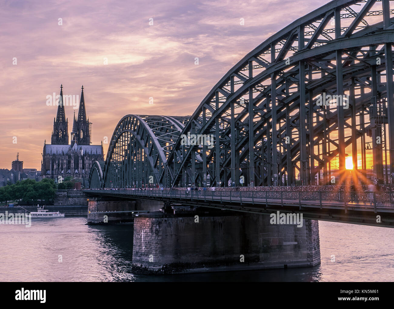 sunset sky with colors and clouds over the city skyline Cologne with ...
