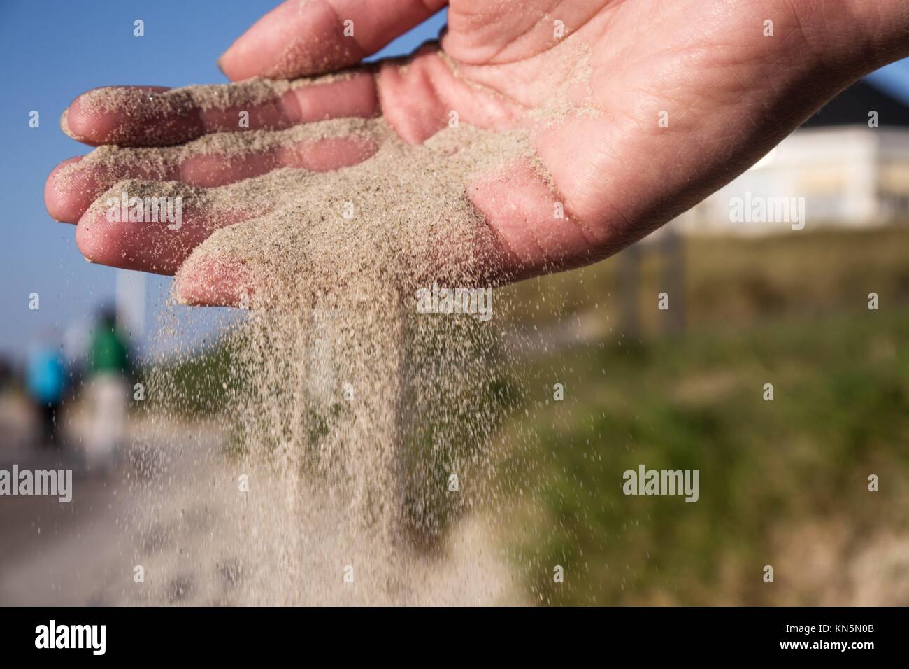 Sand running through hand symbol hi-res stock photography and images ...