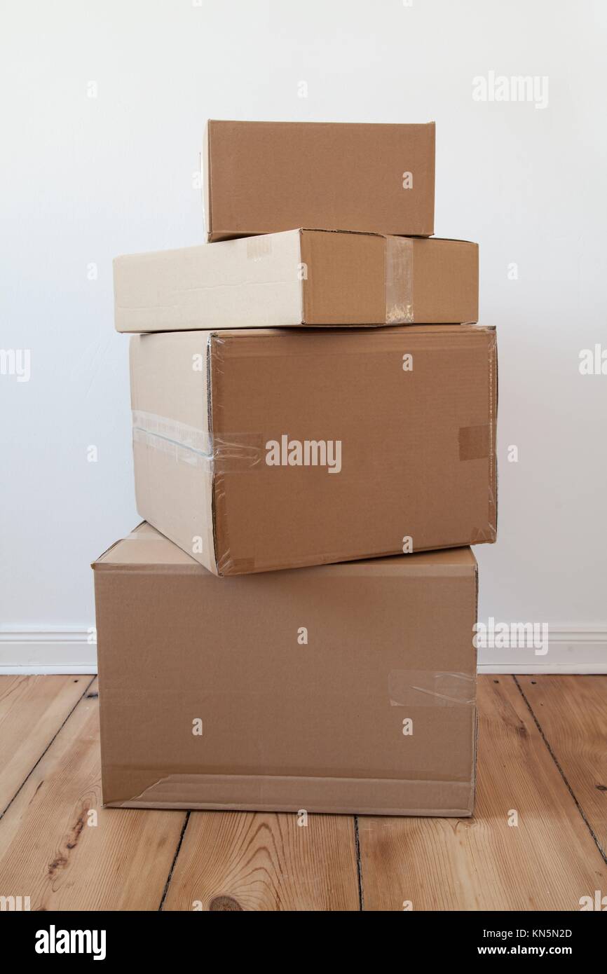 cardboard boxes in a room Stock Photo - Alamy