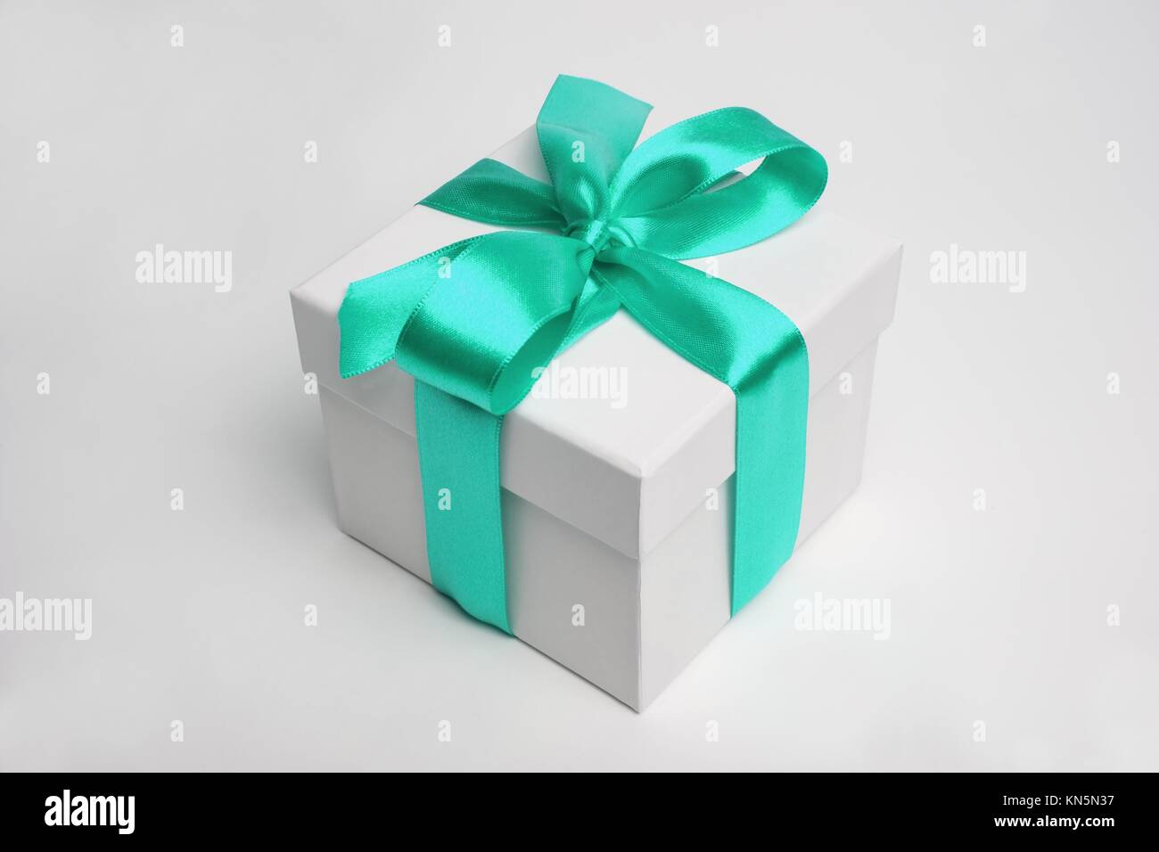 white gift box and cyan ribbon Stock Photo - Alamy