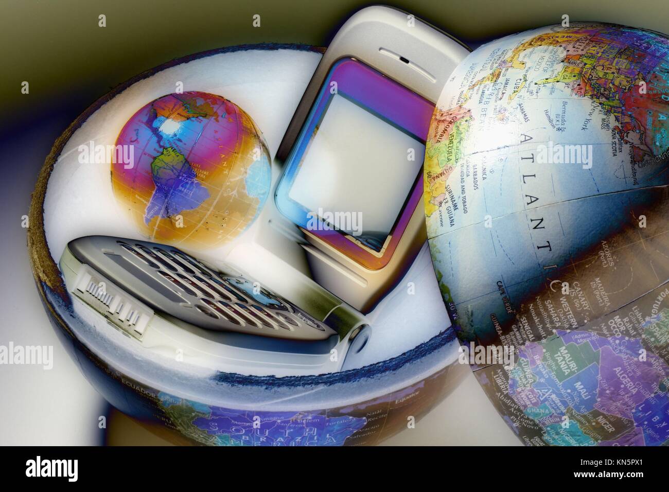 Mobile phone and globe Stock Photo - Alamy
