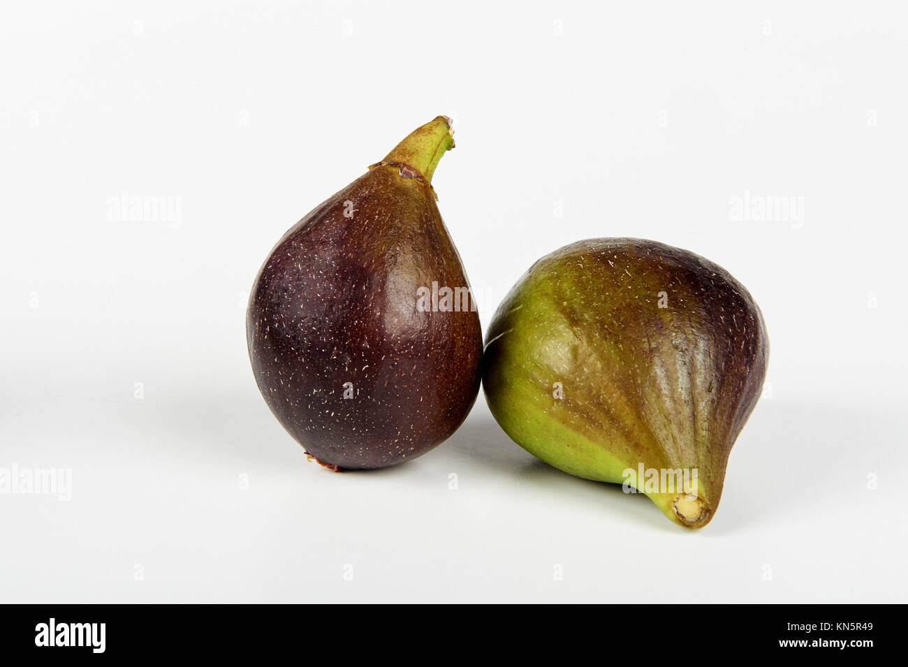 two figs on white background Stock Photo - Alamy
