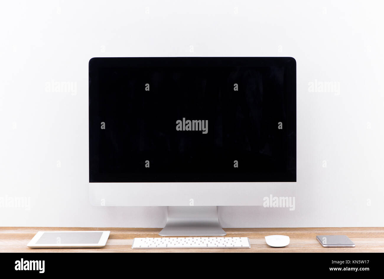 Workplace with computer on table in modern room Stock Photo - Alamy
