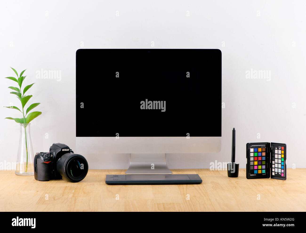 workplace with computer and flower pots in modern office Stock Photo ...