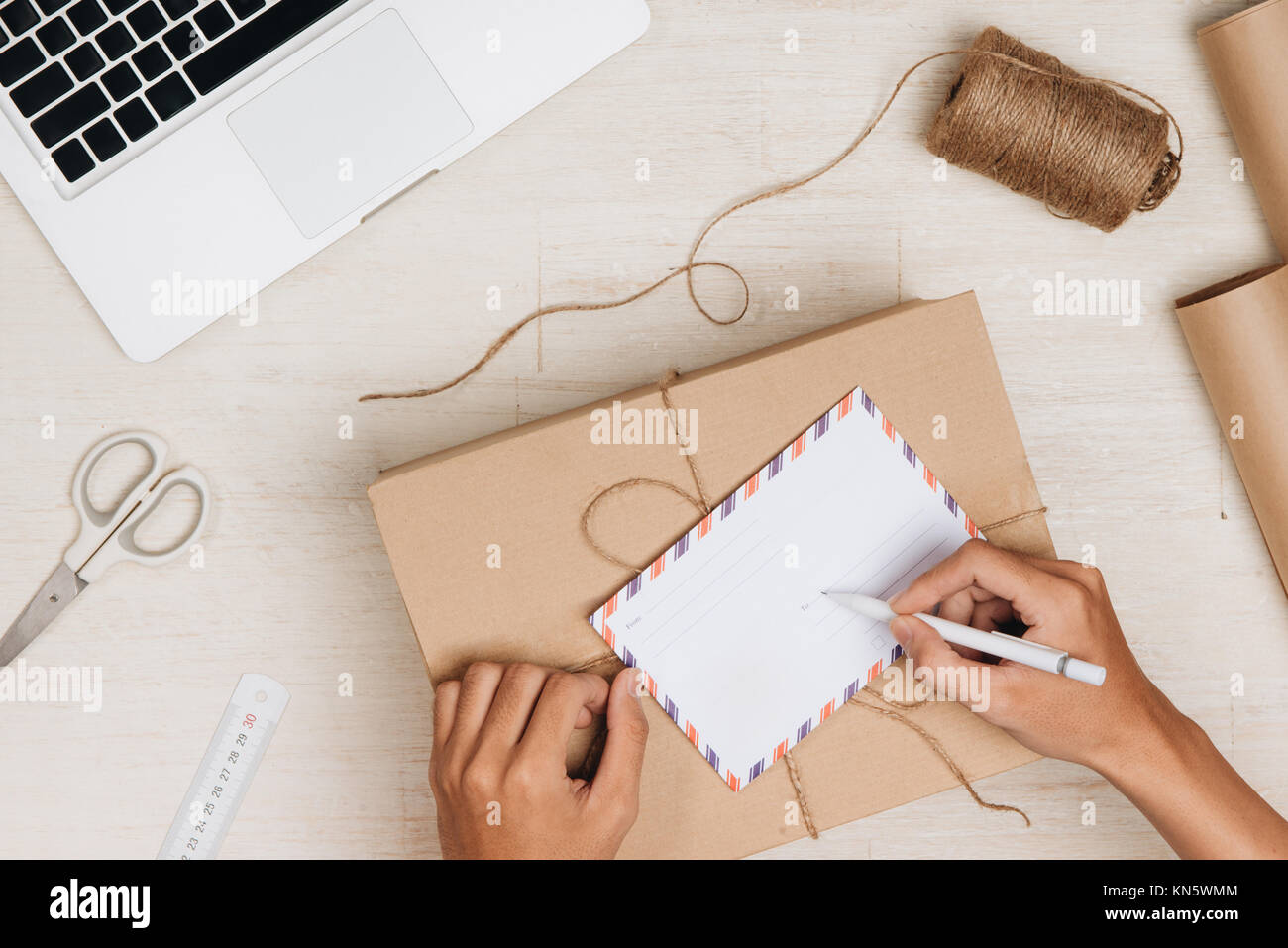 Cardboard boxes on work place in post office Stock Photo - Alamy