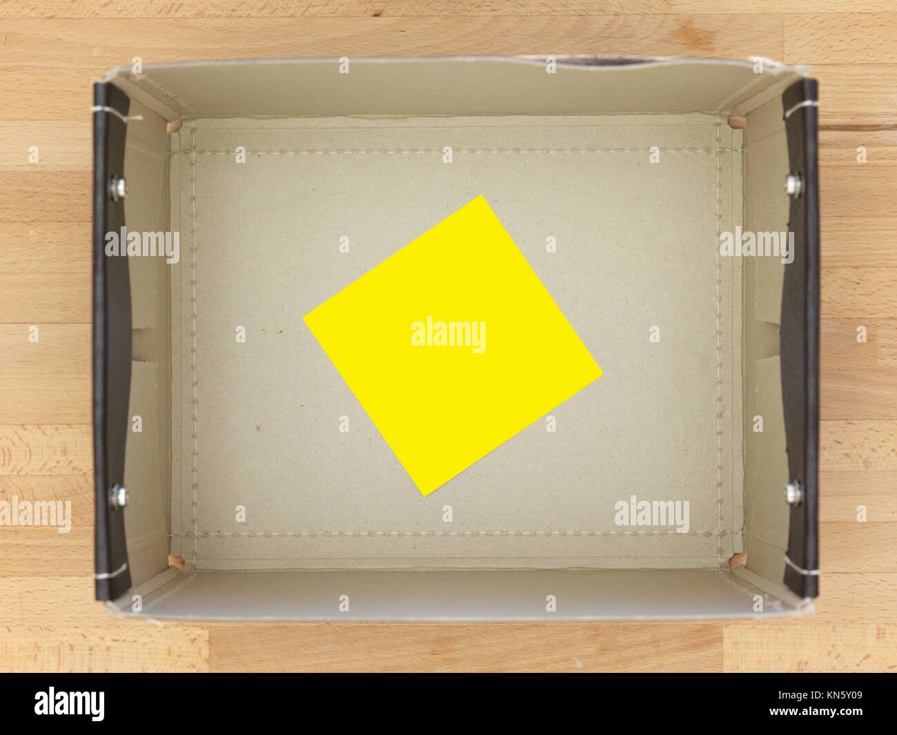 Storage boxes isolated on a wooden shelf Stock Photo - Alamy