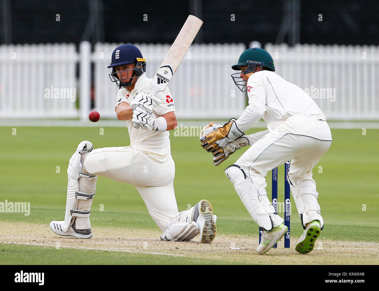 England Tom Curran sweeps a delivery fine for a boundary during day one ...
