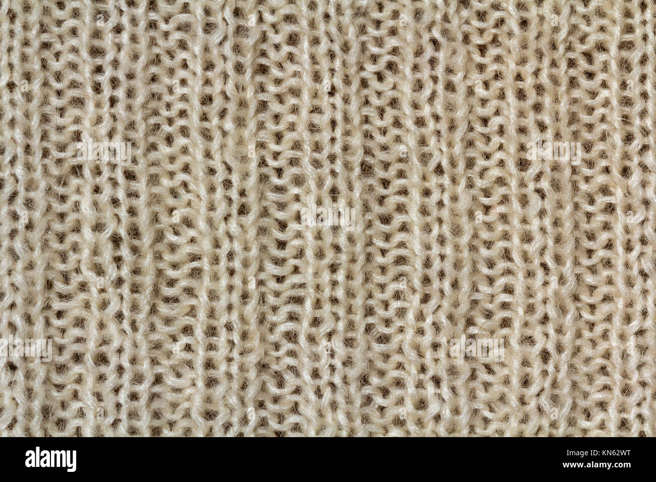 Background texture of beige pattern knitted fabric made of cotton or ...