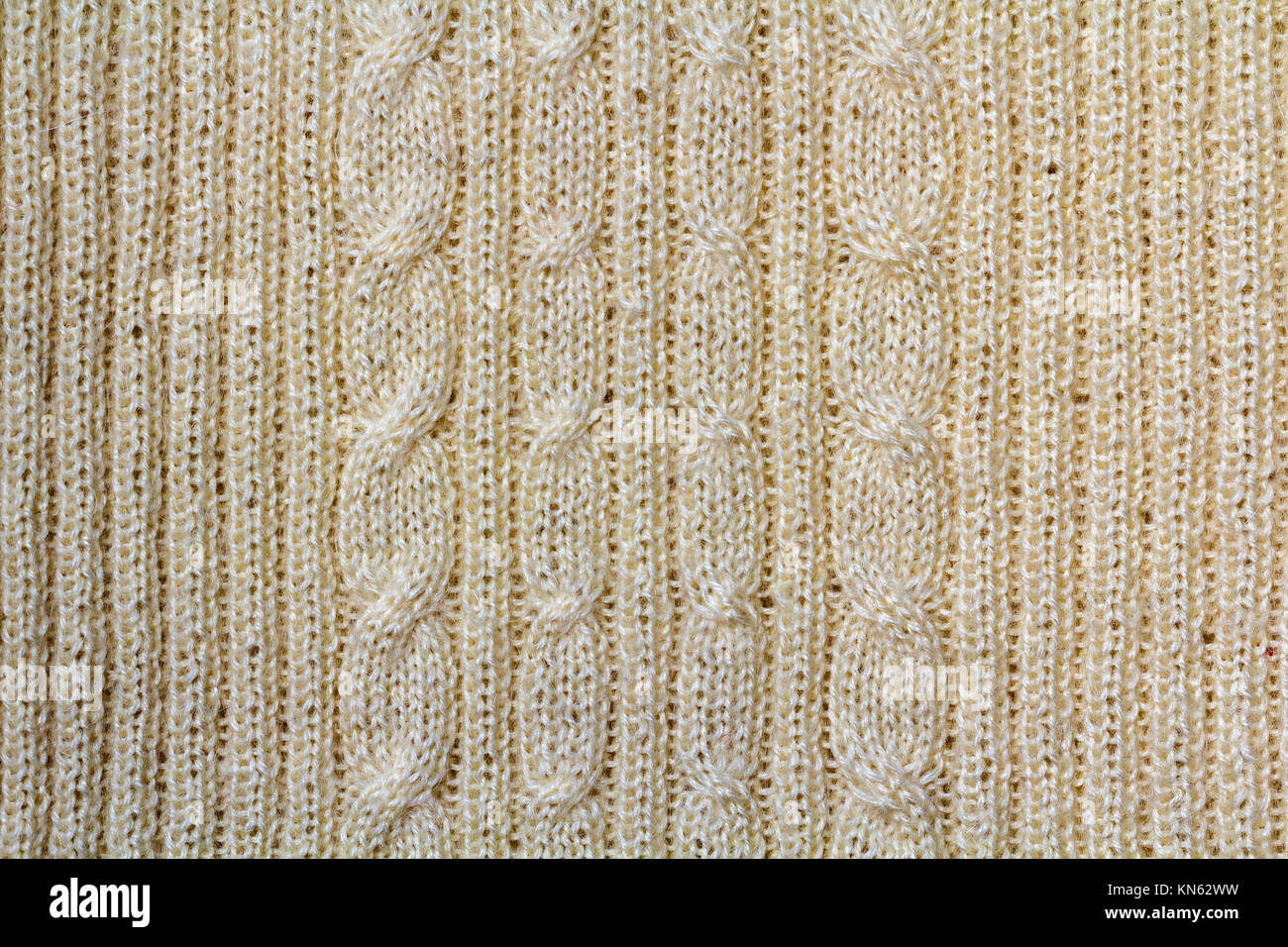 Background texture of beige pattern knitted fabric made of cotton or ...
