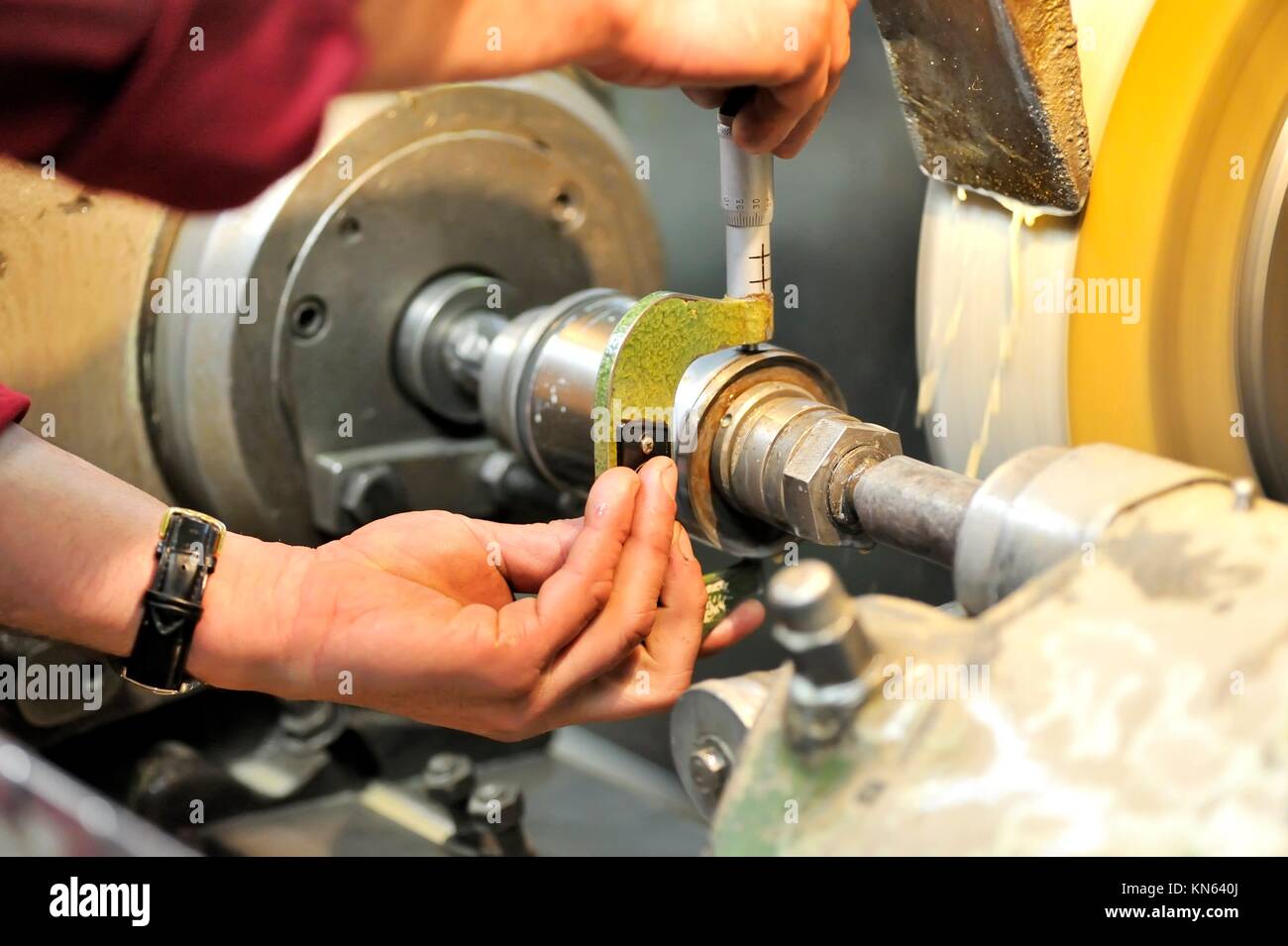 Close up of measuring metal part on lathe Stock Photo - Alamy