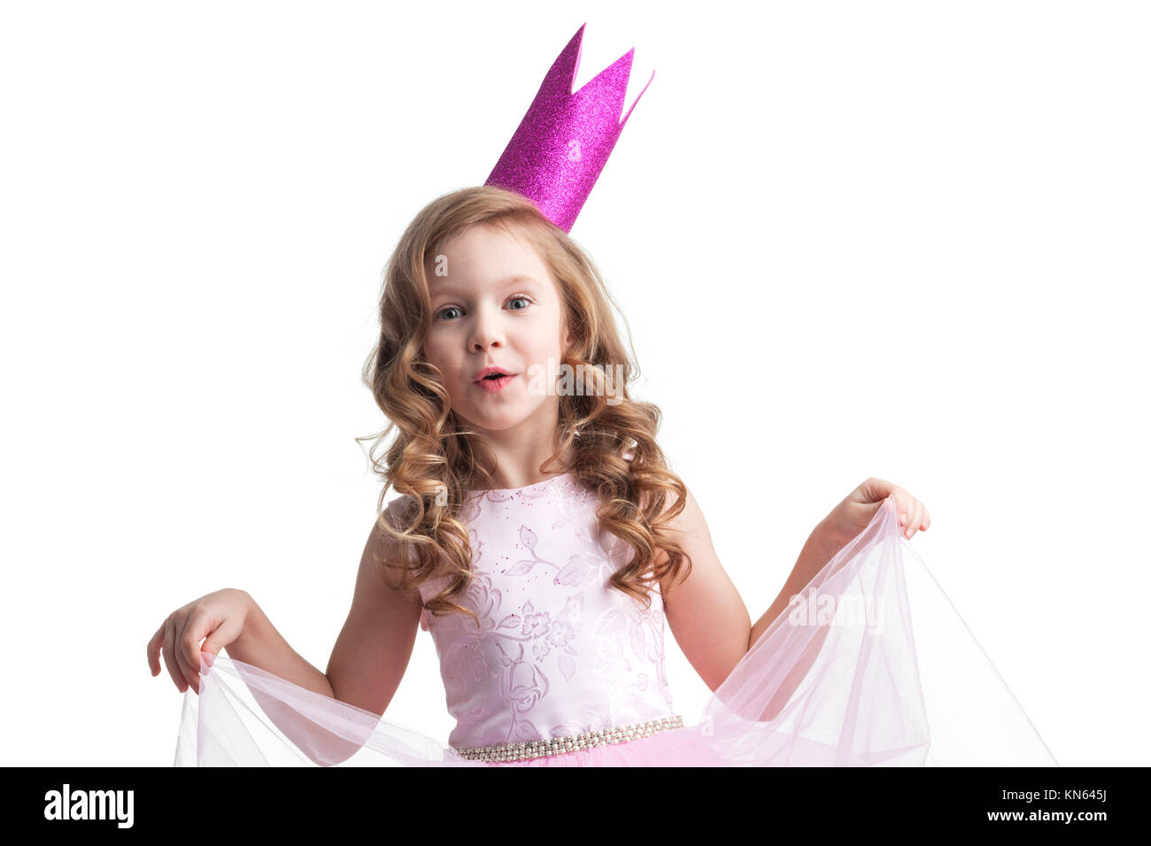 Happy small princess girl in pink dress and crown isolated on white ...