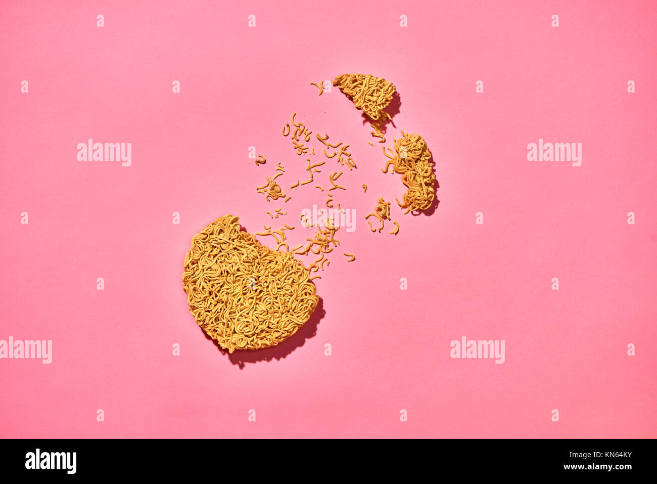 Cracked Instant noodles isolated on a pink background Stock Photo - Alamy