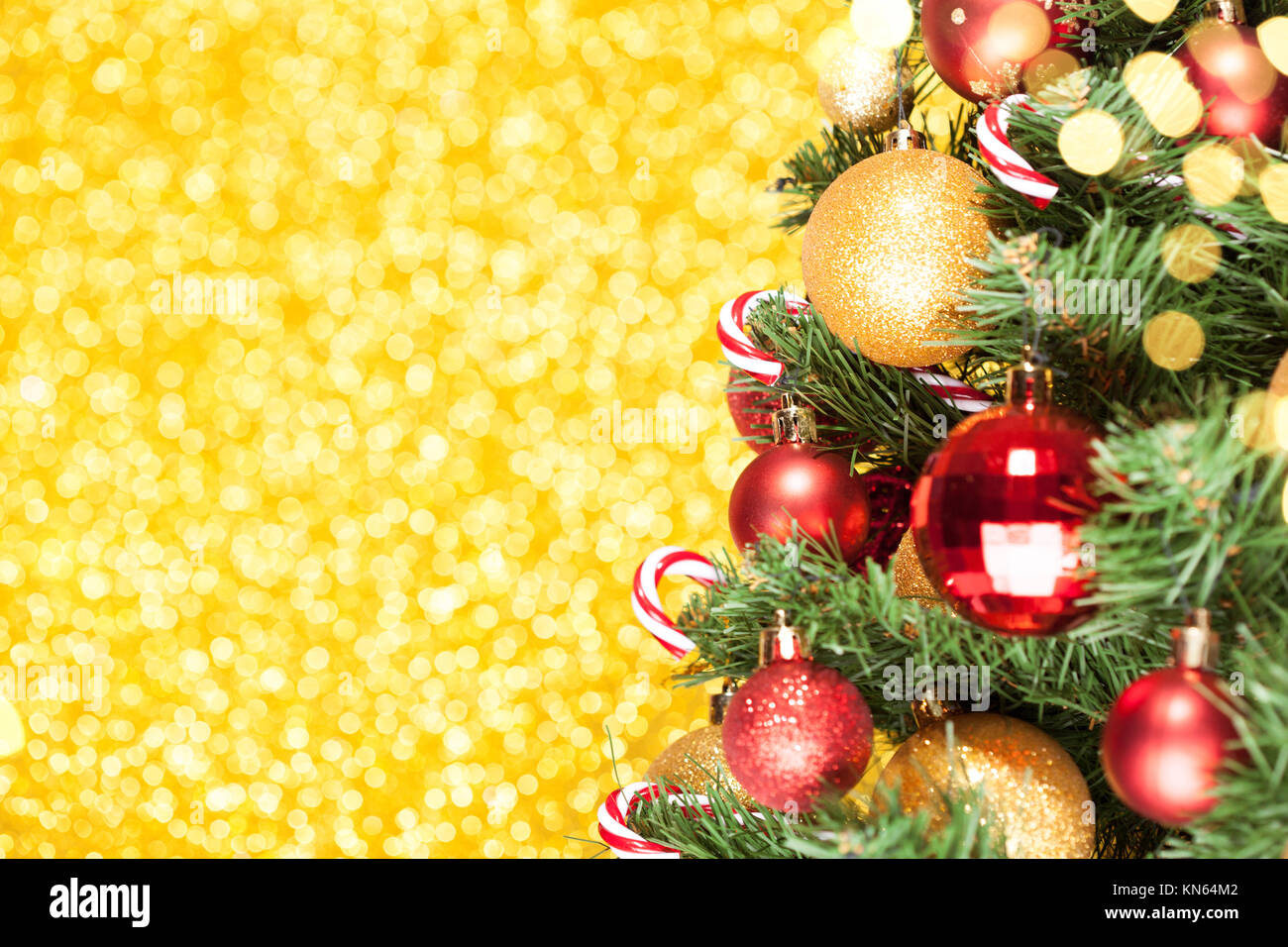 Christmas tree with Decoration over Glittering Golden Background Stock ...