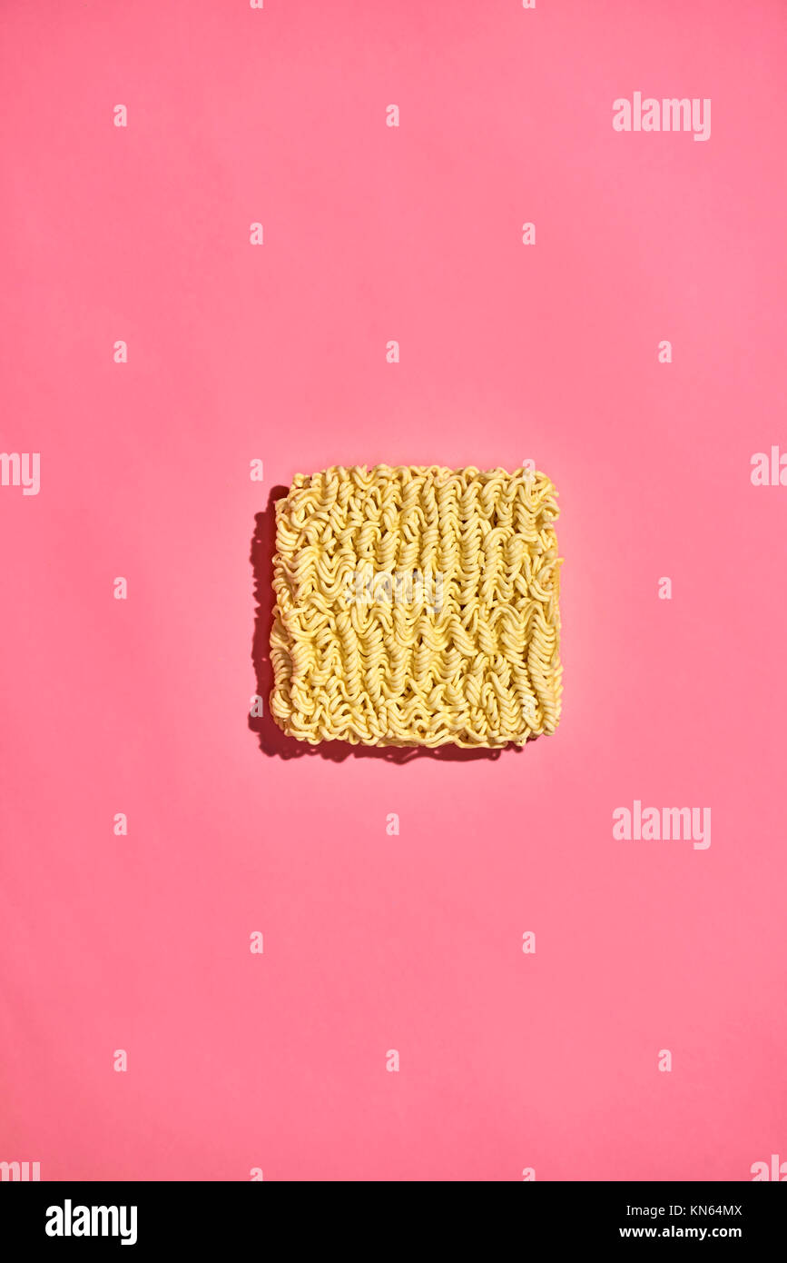 Dried instant noodles isolated on a pink background Stock Photo - Alamy